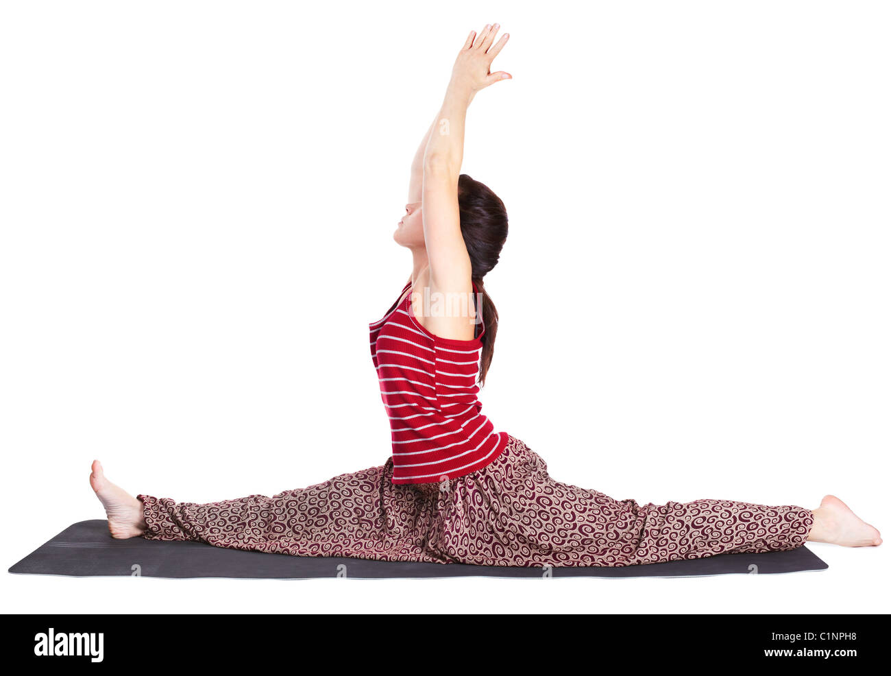 full-length portrait of beautiful woman doing the yoga splits ...