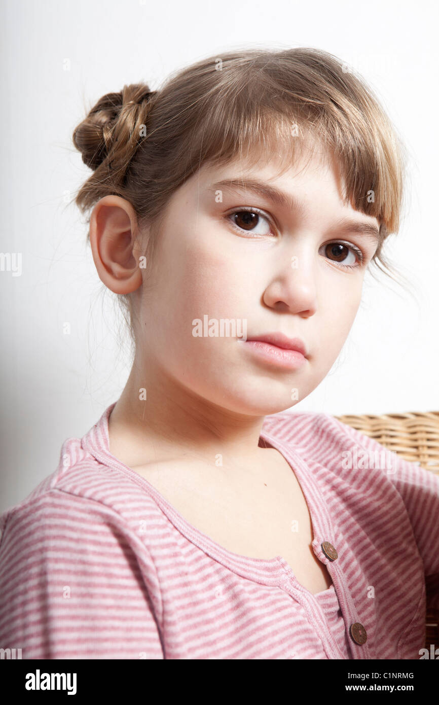 portrait of serious little girl nine years old Stock Photo - Alamy