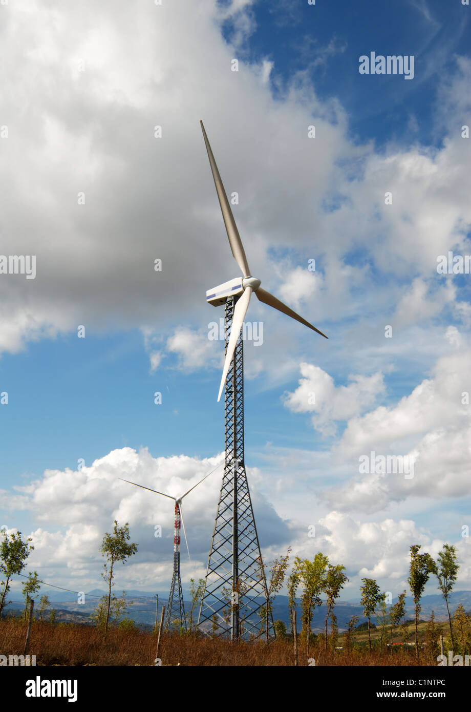 Large wind turbine among small trees Stock Photo - Alamy