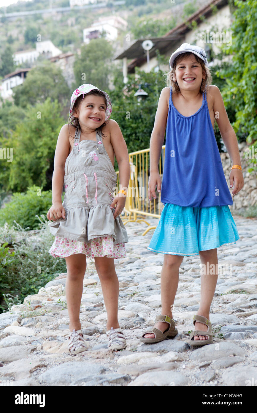 Two sisters laugh outdoors, happy family Stock Photo - Alamy