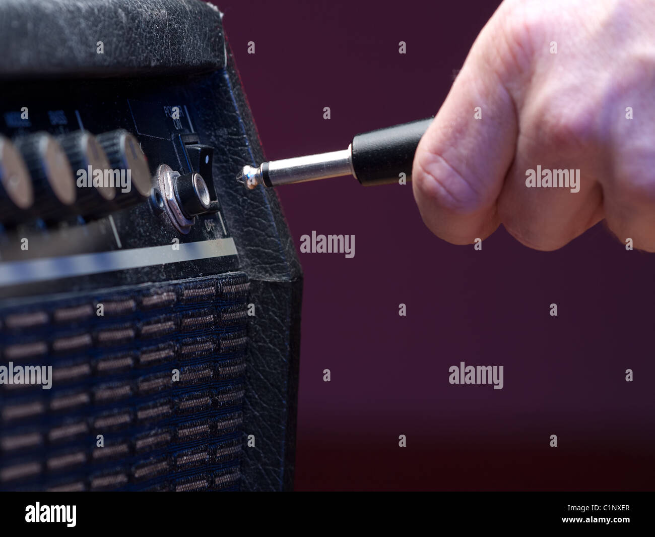 plugging into the amplifier, closeup, for music,entertainment themes ...