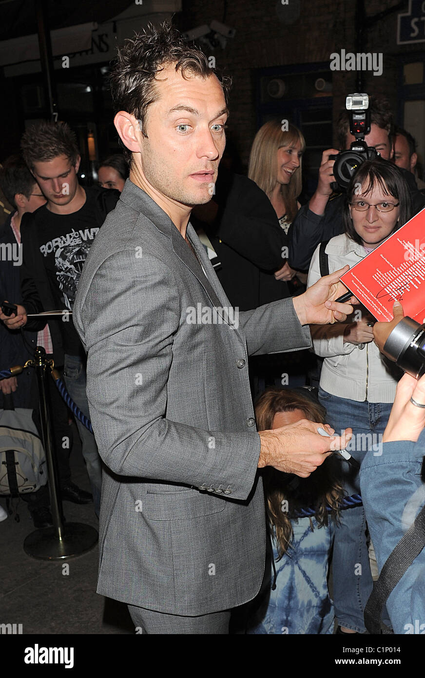 Jude Law signs autographs and poses for pictures with fans, before ...