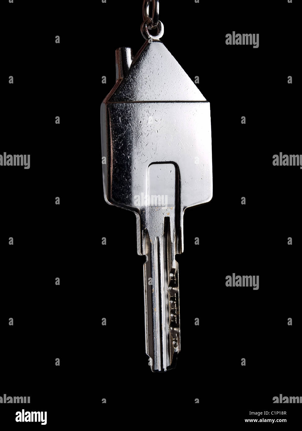 Key as a symbol of owning your own home isolated on black background ...