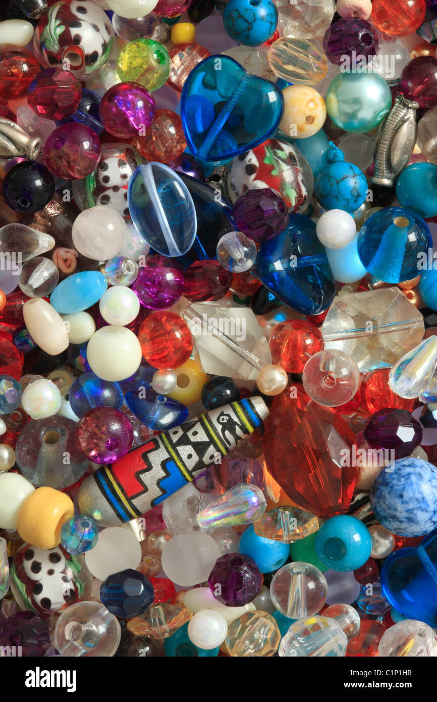 Beads background in assorted colours, shapes and sizes Stock Photo - Alamy