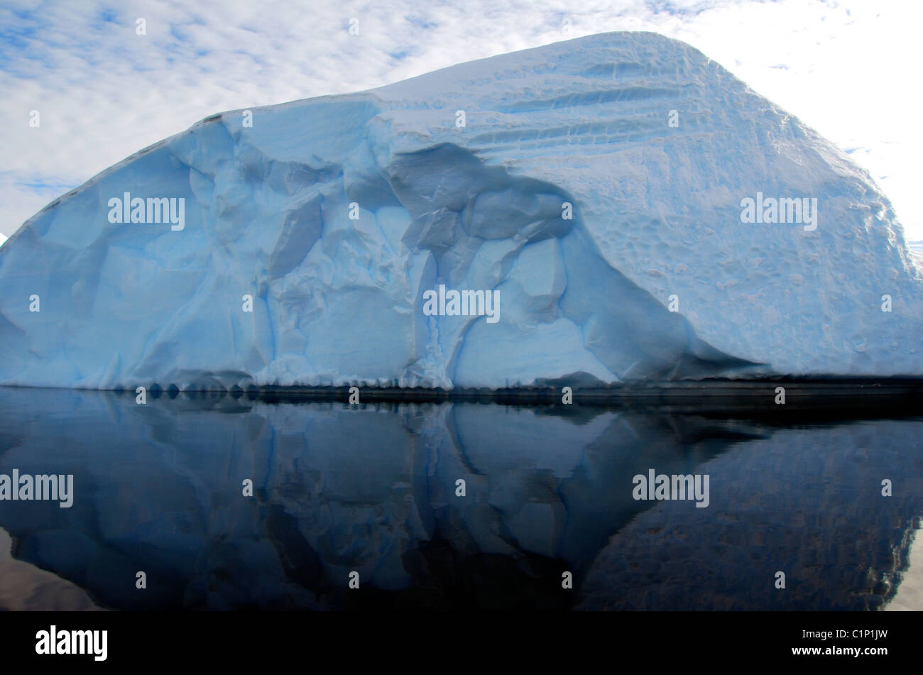 oval iceberg reflected in water Stock Photo - Alamy