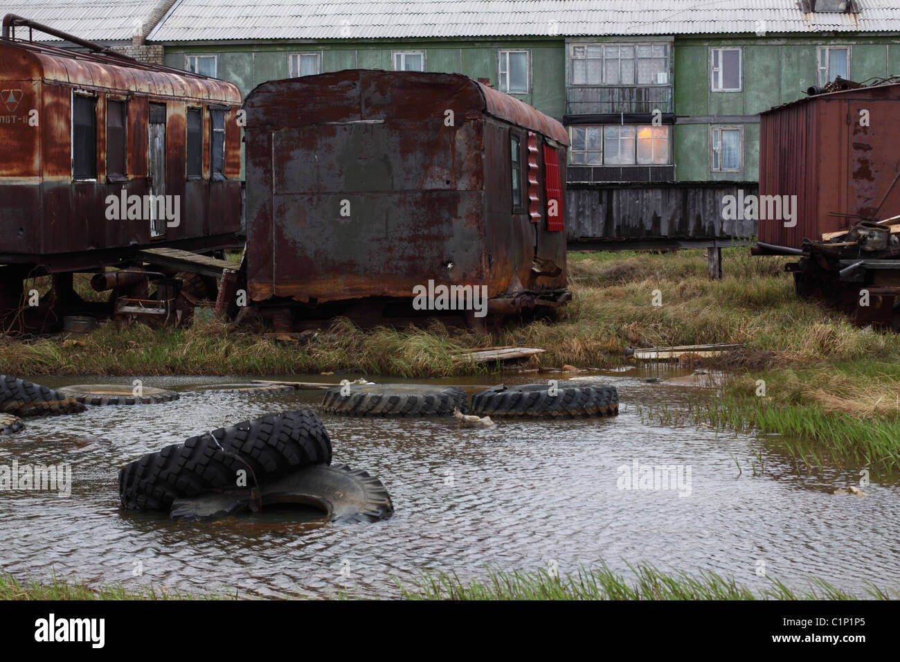 The big pools between houses are filled by various garbage Stock Photo ...