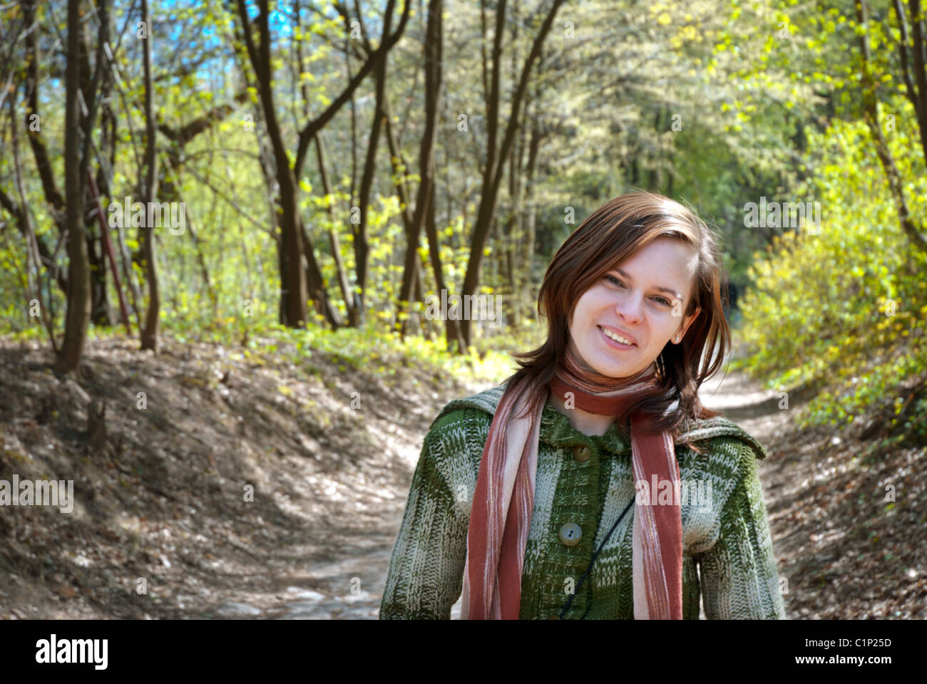 Young smiling woman in the forest Stock Photo - Alamy
