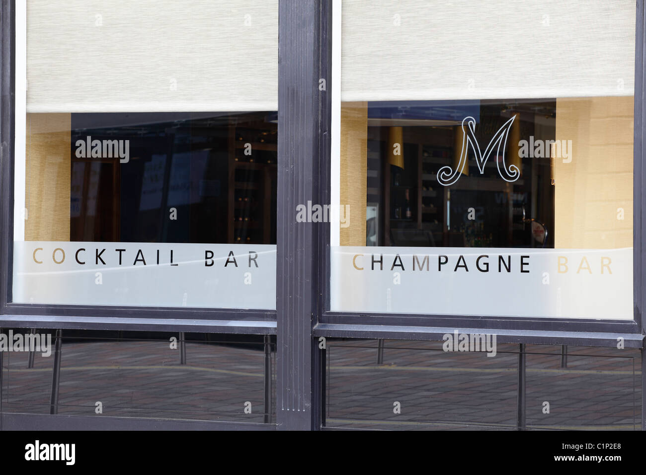 Cocktail Bar and Champagne Bar signs in the exterior windows of ...