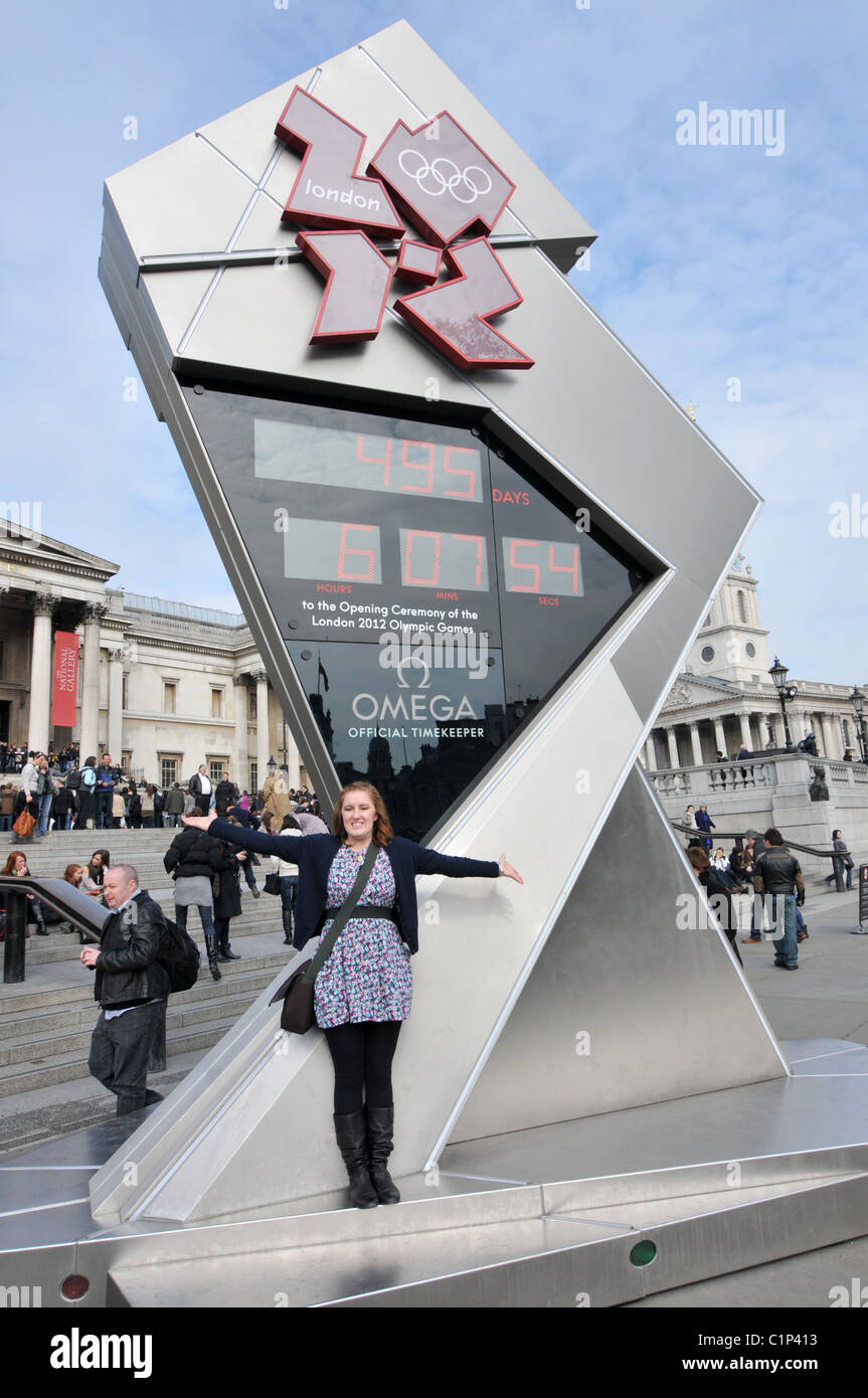 London 2012 Olympics clock Trafalgar Square tourists posing Stock Photo ...