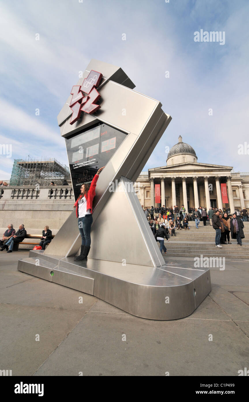 London 2012 Olympics clock Trafalgar Square tourists posing Stock Photo ...