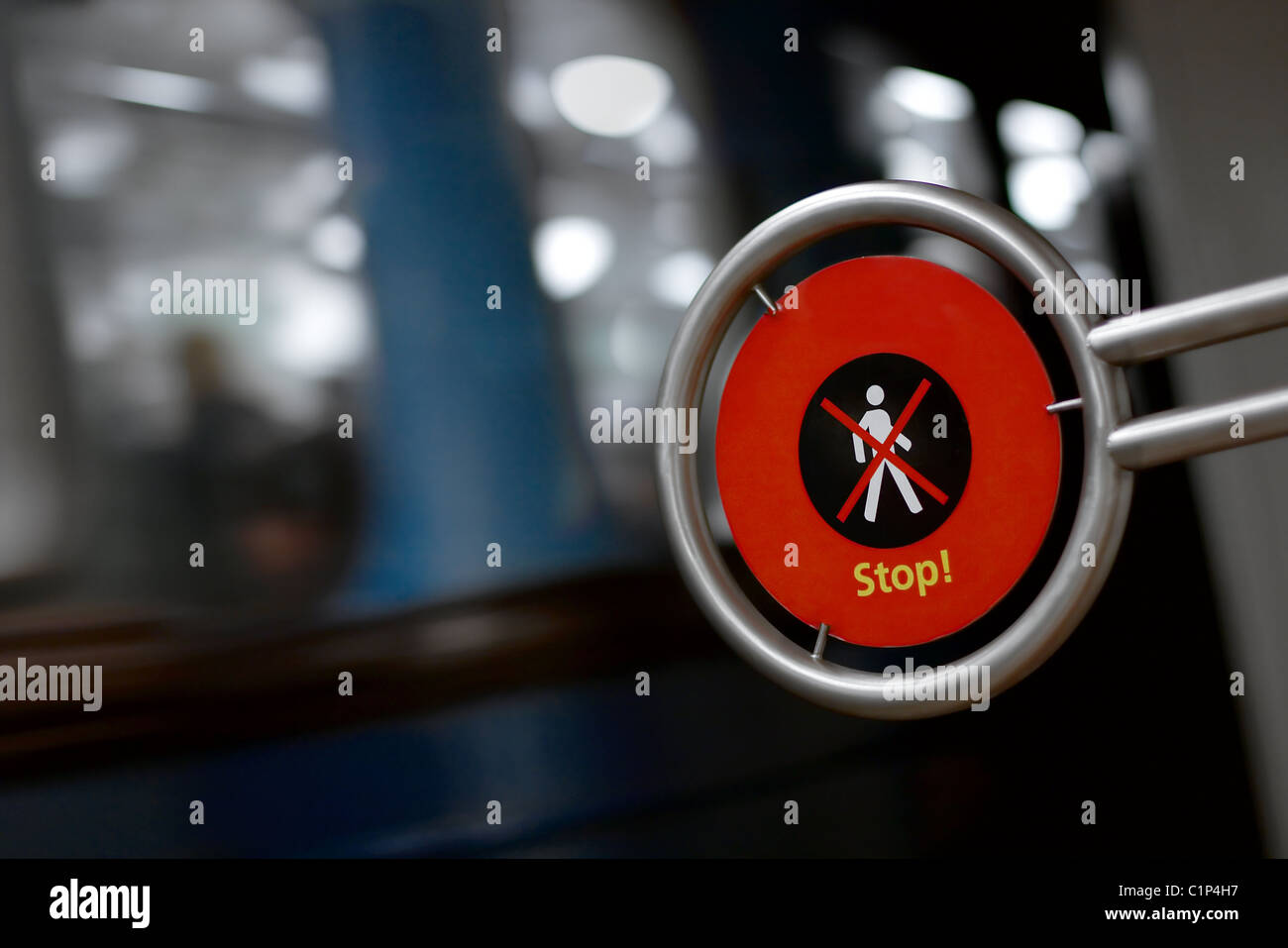 Warning sign far pedestrians with metro vehicle passing by with motion ...