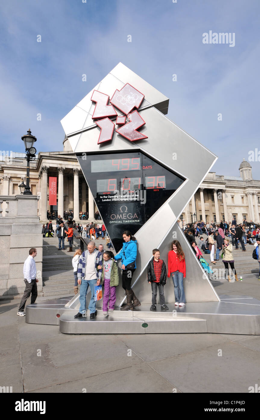 London 2012 Olympics clock Trafalgar Square tourists posing Stock Photo ...