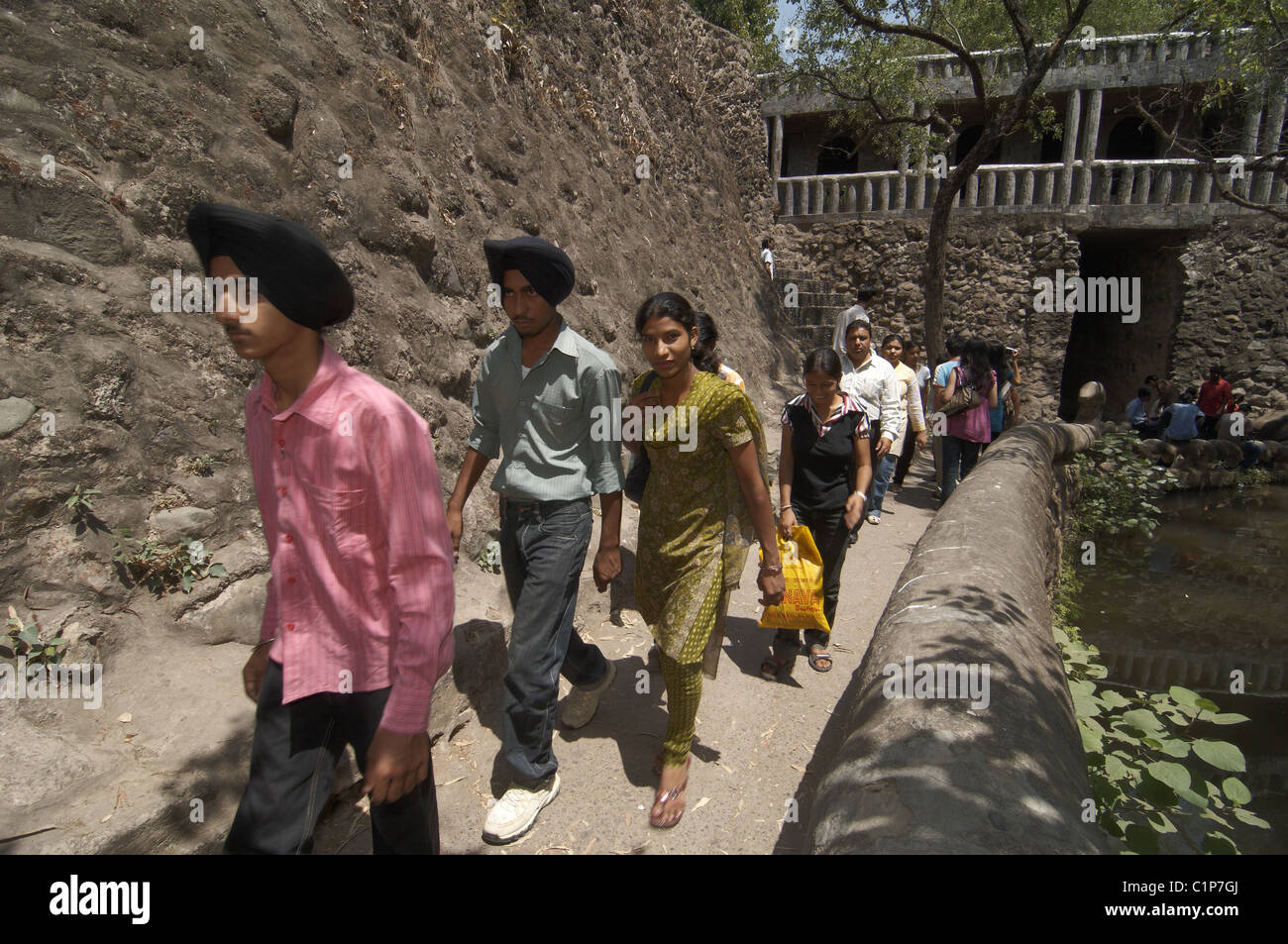 People enjoy the tourist attraction of the Rock Garden in Chandigarh ...