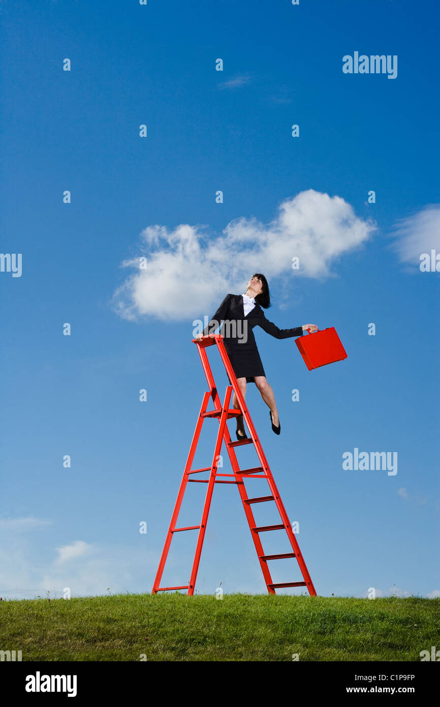 Balancing on ladder hi-res stock photography and images - Alamy