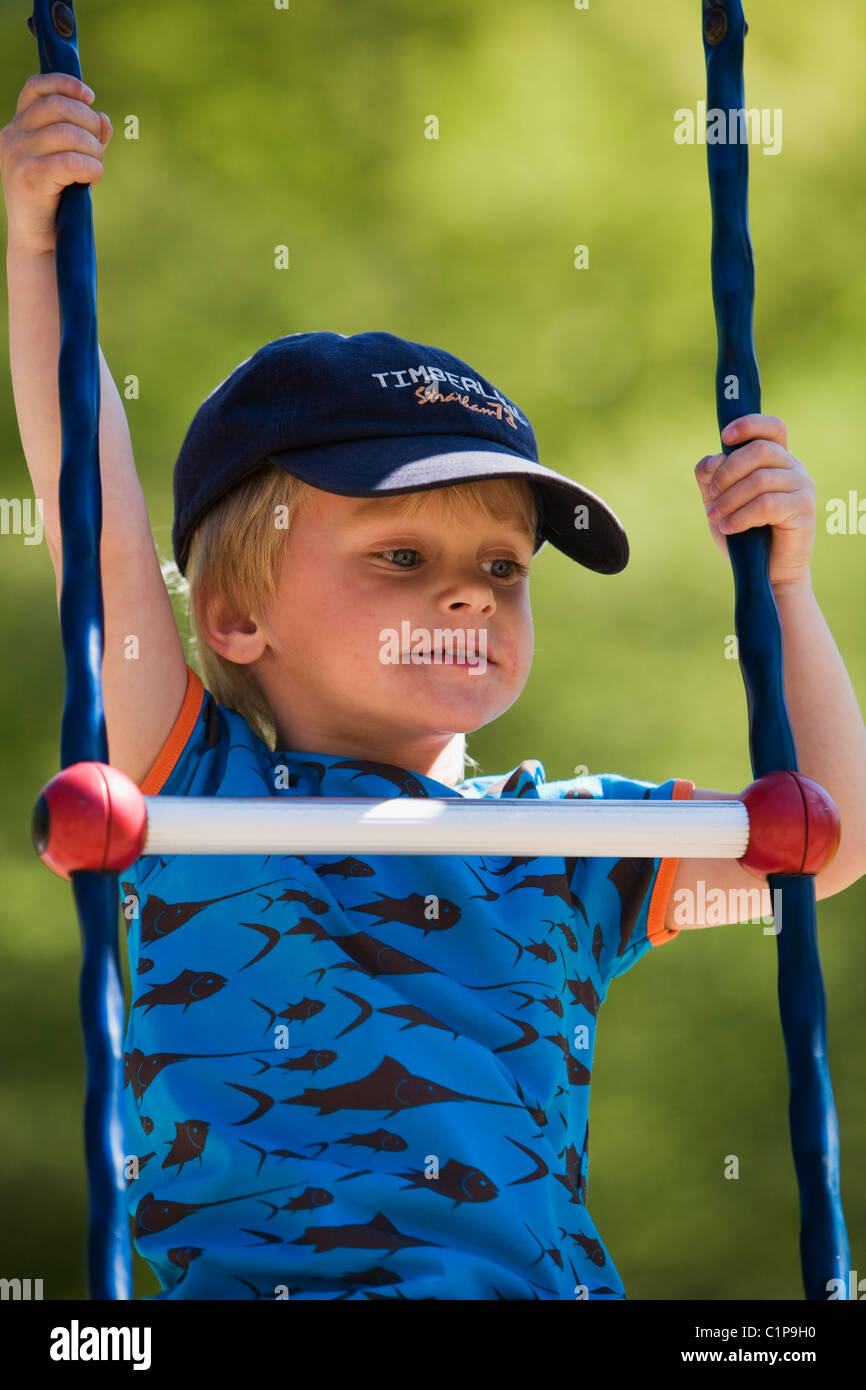 Boy climbing ladder at playground Stock Photo - Alamy