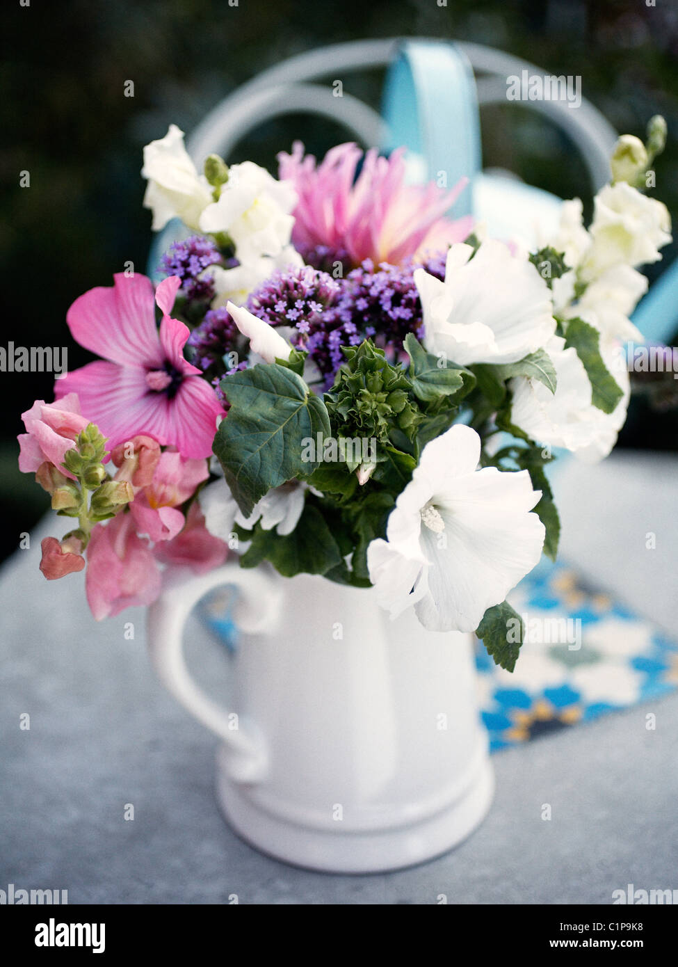 Various flowers in jug, close-up Stock Photo - Alamy