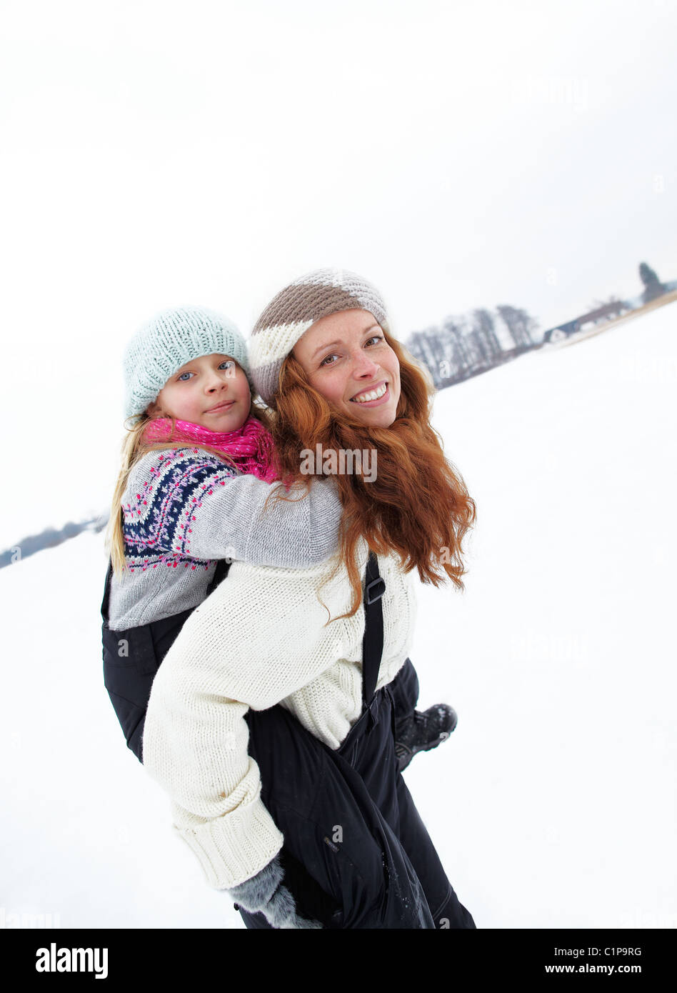 Mother daughter piggyback looking up hi-res stock photography and images - Alamy