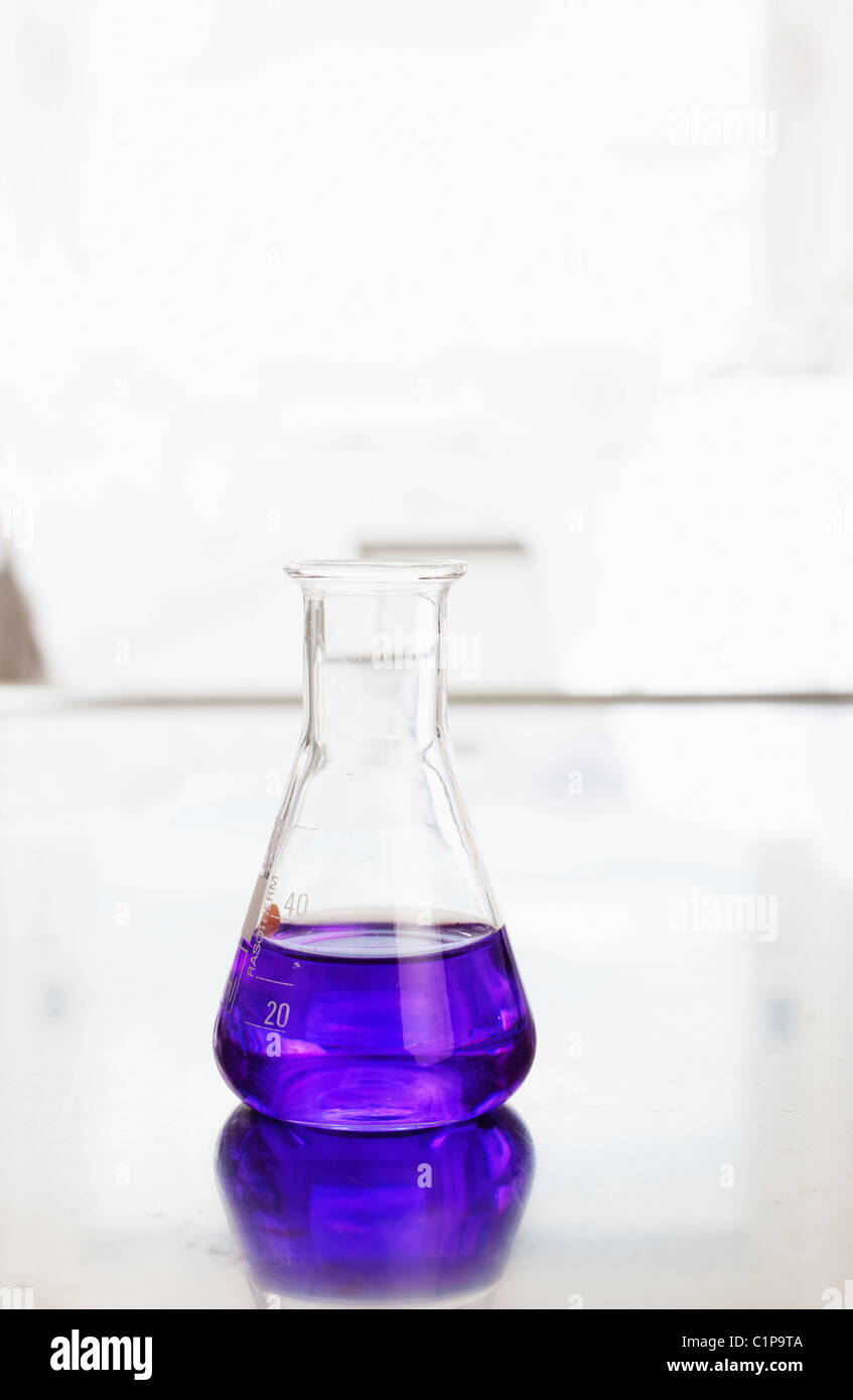 Conical flask with purple liquid Stock Photo - Alamy