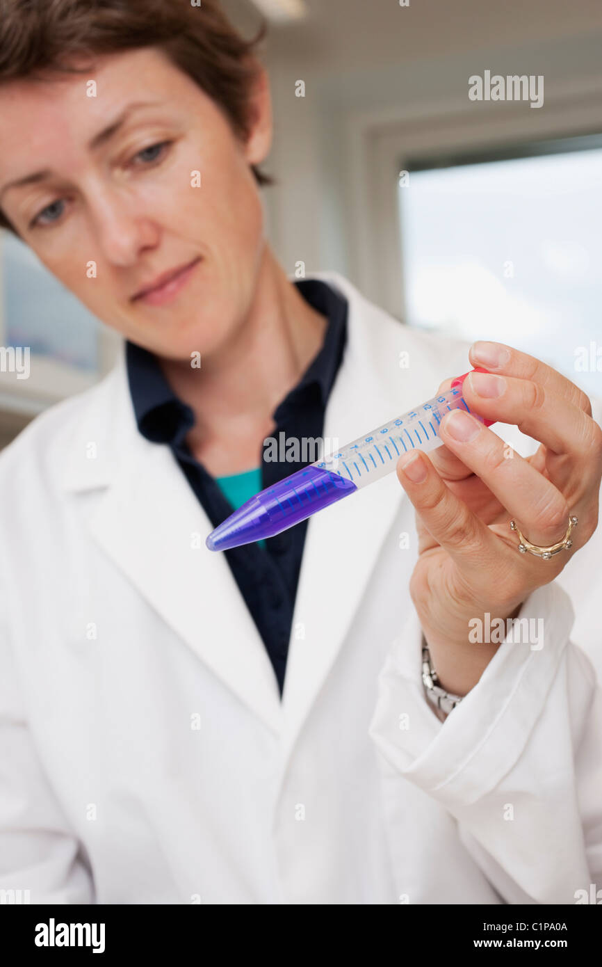 Scientist holding test tube Stock Photo - Alamy