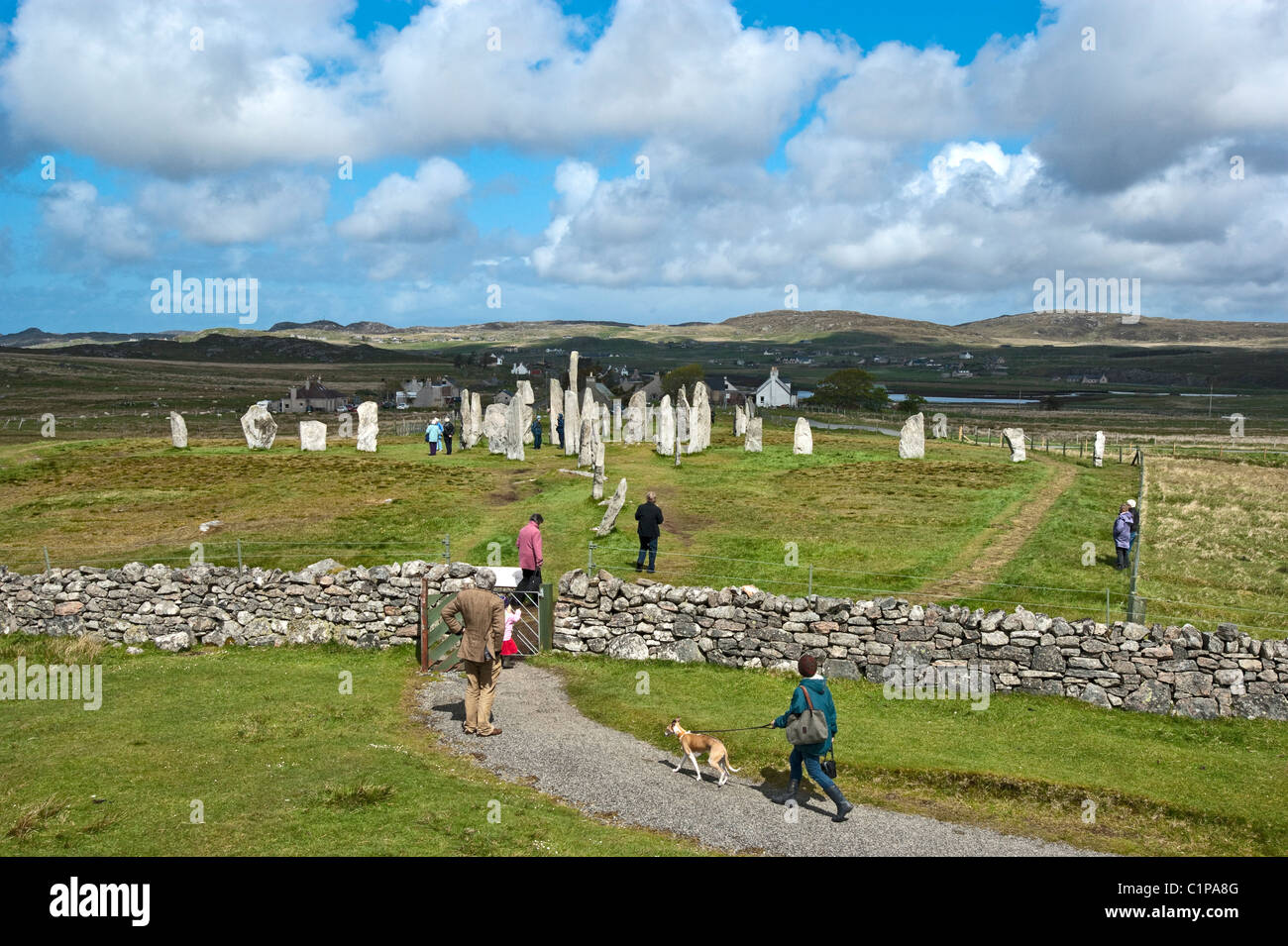 Visitors passing through entrance gate to Callanish Standing Stones on ...
