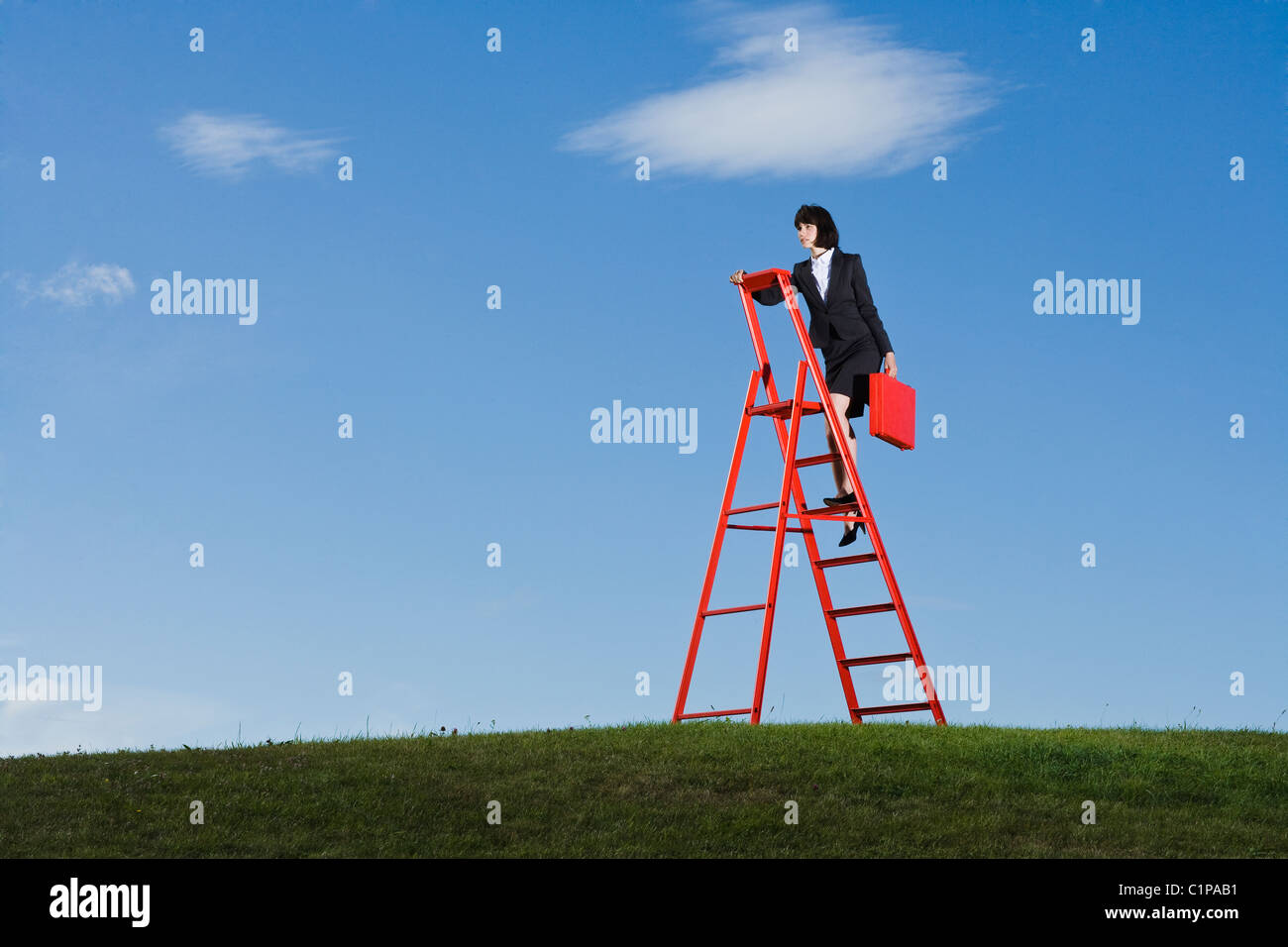 Women climbing ladders hi-res stock photography and images - Alamy