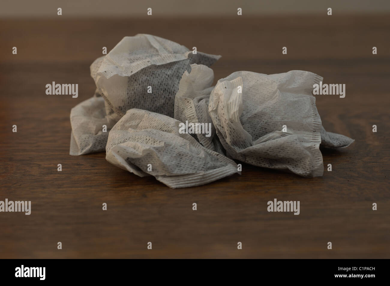 Tea bags on an oak dining table Stock Photo - Alamy