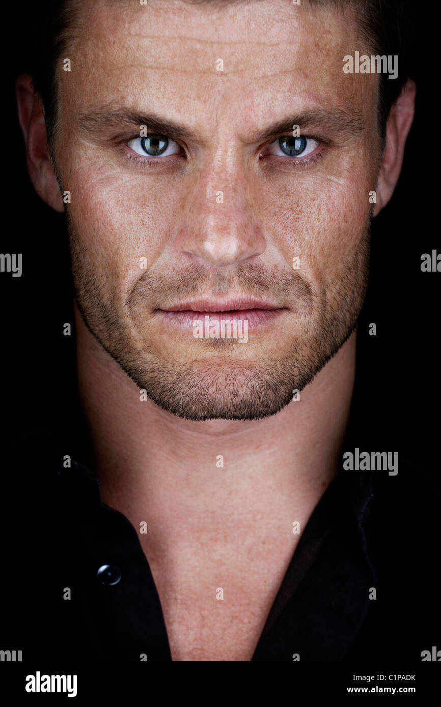 Portrait of man against black background Stock Photo - Alamy