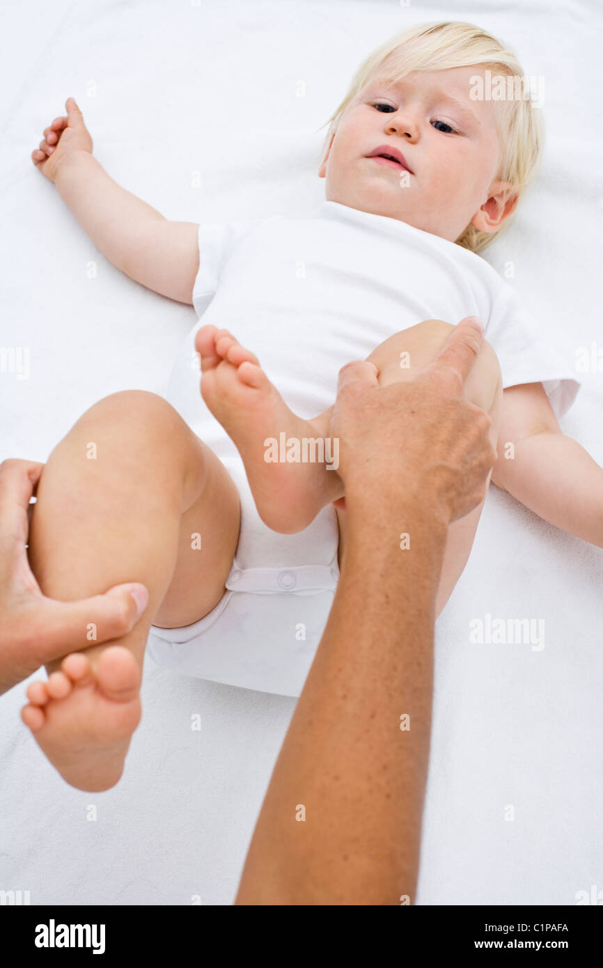Baby boy having massage Stock Photo - Alamy