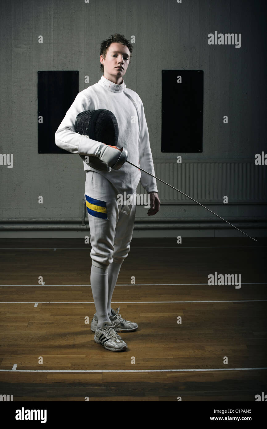 Portrait of male fencer in sports hall Stock Photo - Alamy