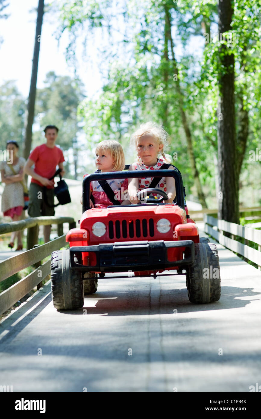 Two girls in go-cart Stock Photo - Alamy