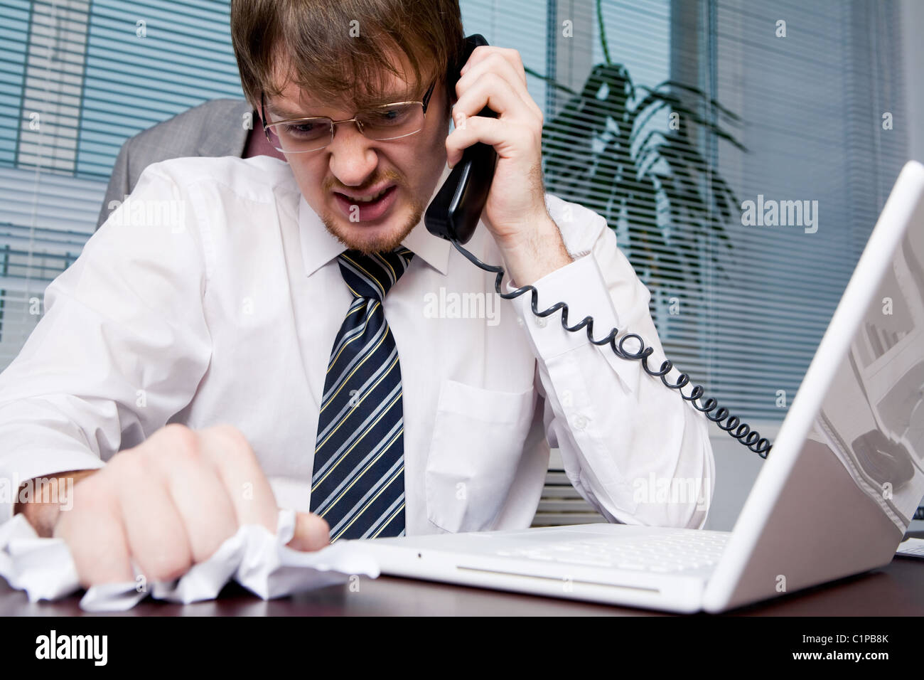 Young businessman talking angrily on hi-res stock photography and ...