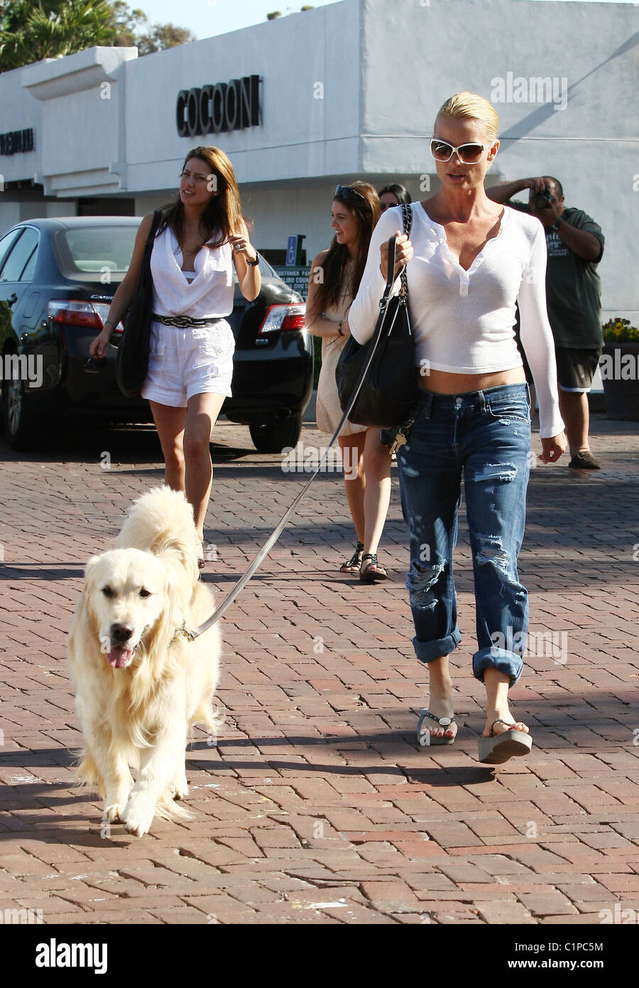 Nicollette Sheridan walking her dog while out shopping with a friends ...