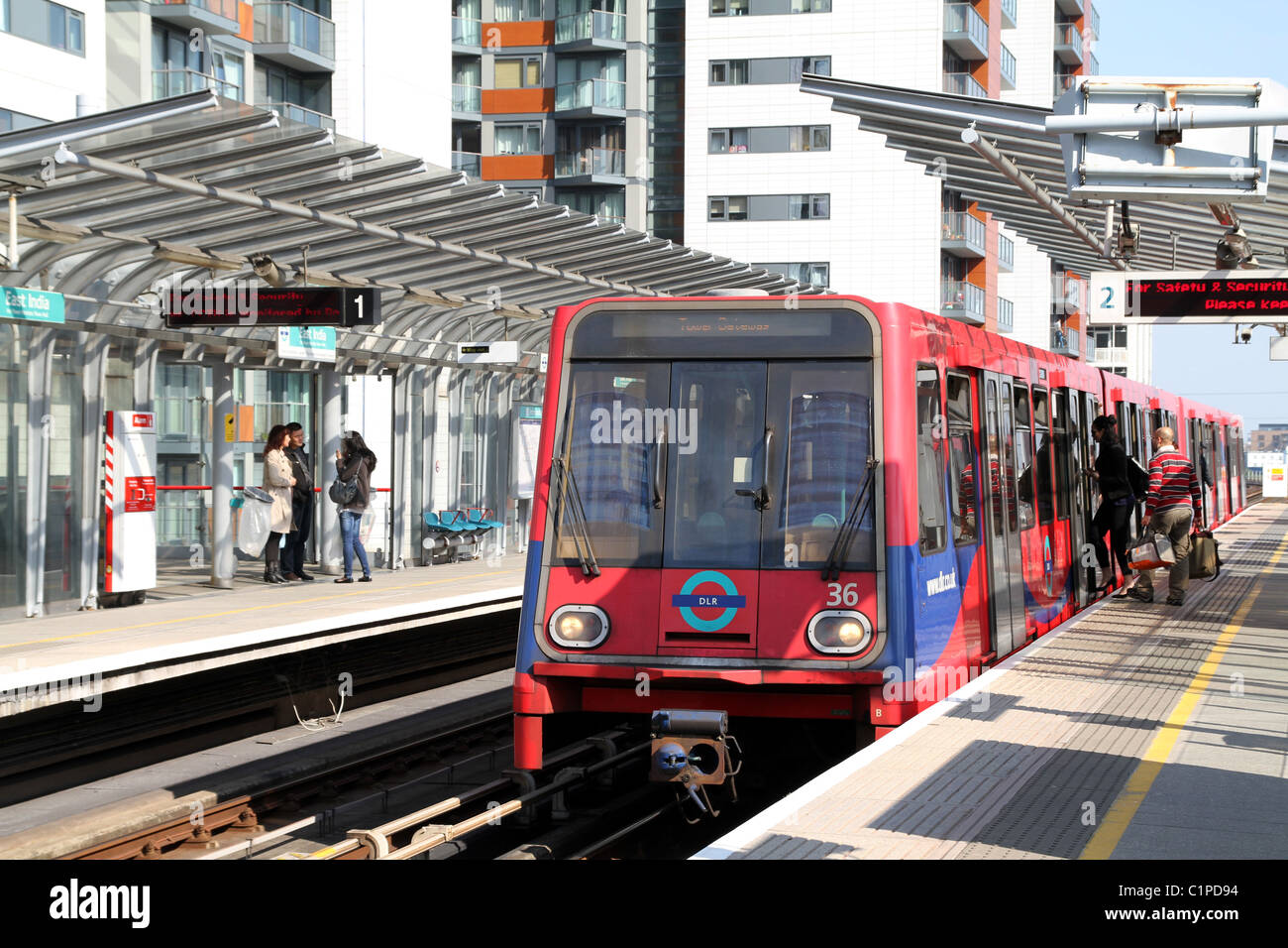 UK. DOCKLANDS LIGHT RAILWAY (DLR) TRAIN STATION IN CANARY WHARF IN IN ...