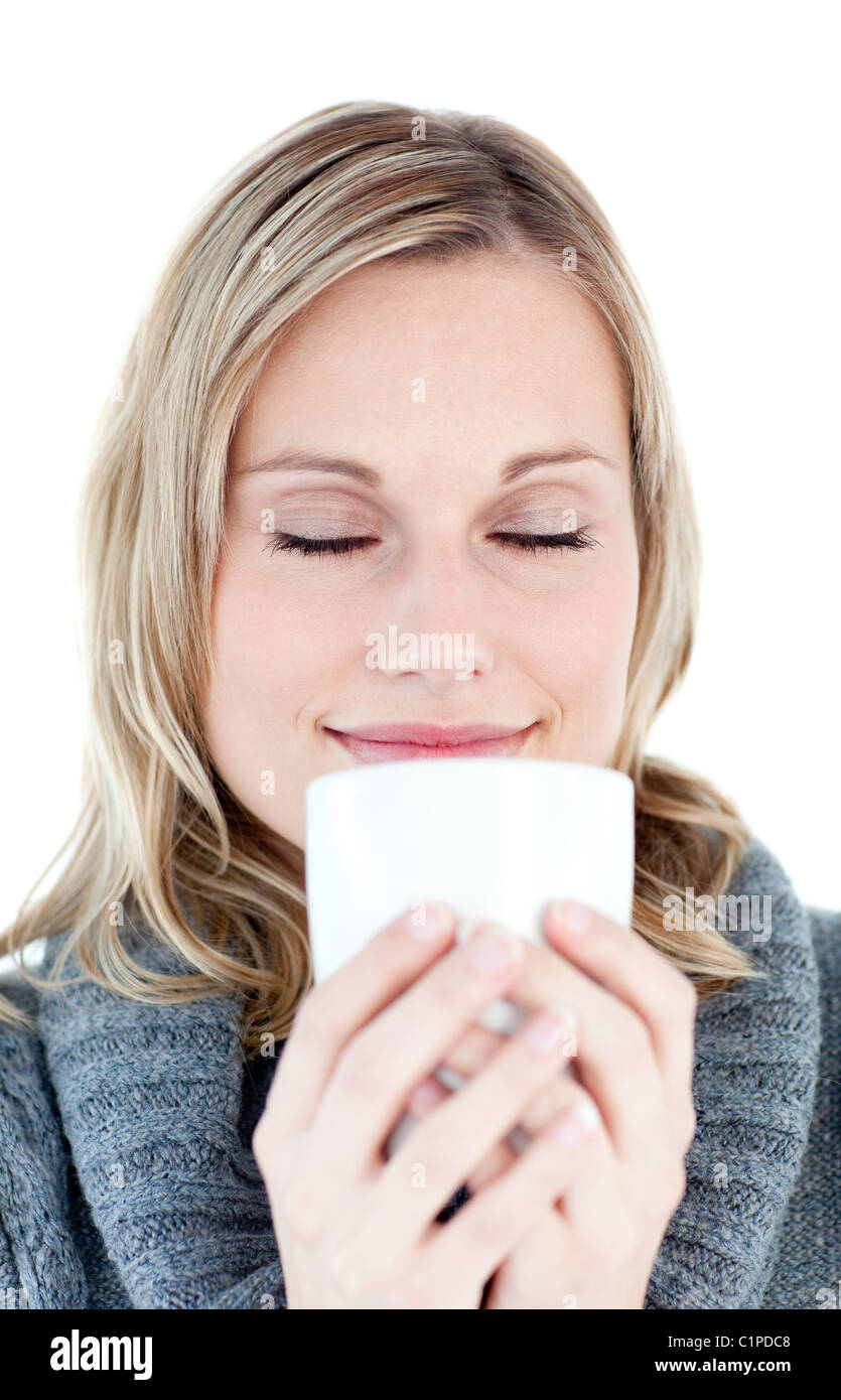 Joyful woman drinking a hot coffee against a white background Stock ...