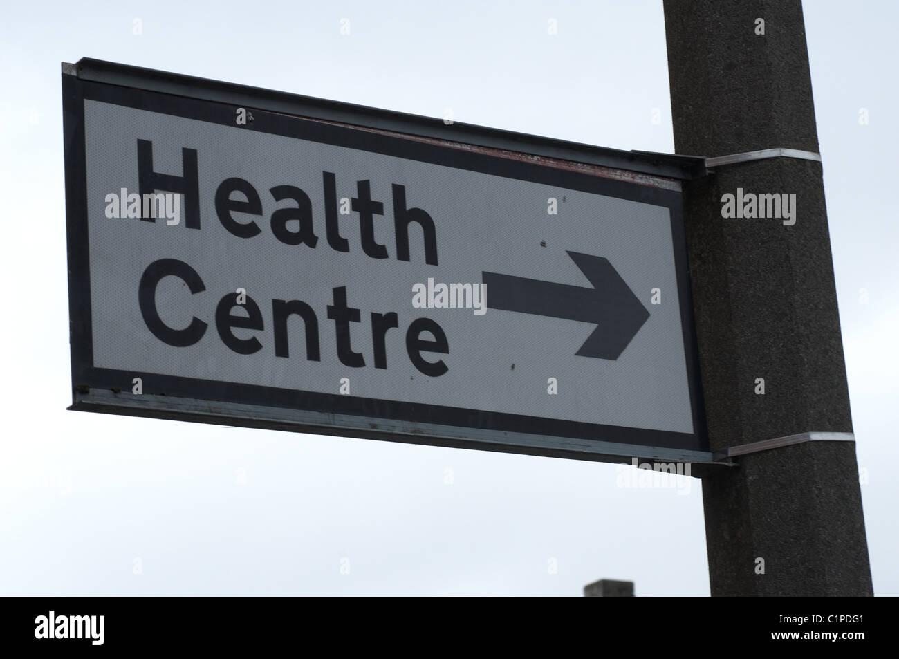 Signs from the British high street. Health Centre sign on lamppost with ...