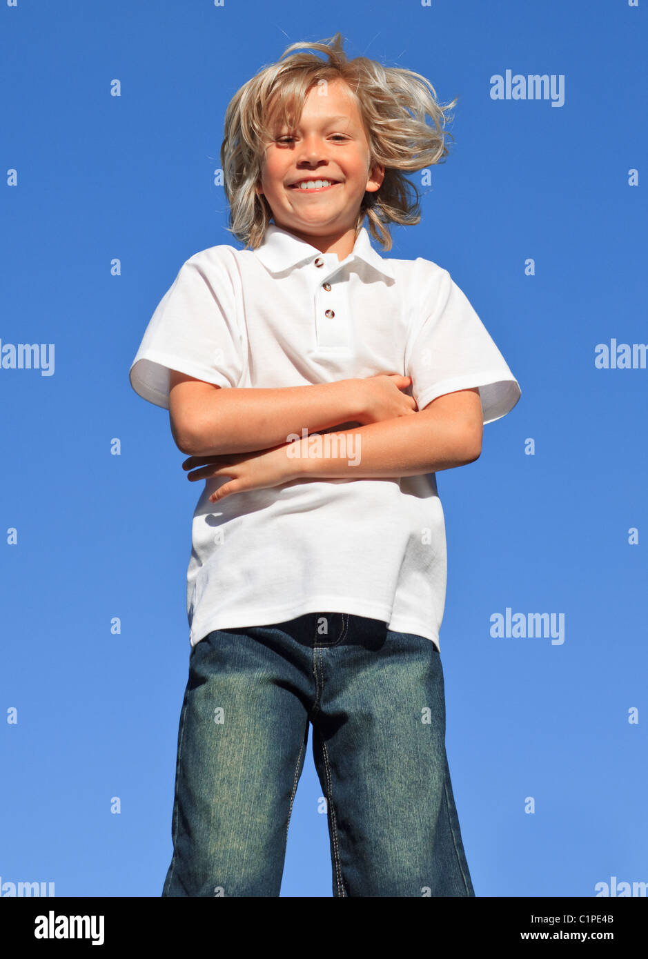 Smiling Kid with arms folded having fun outdoor Stock Photo - Alamy