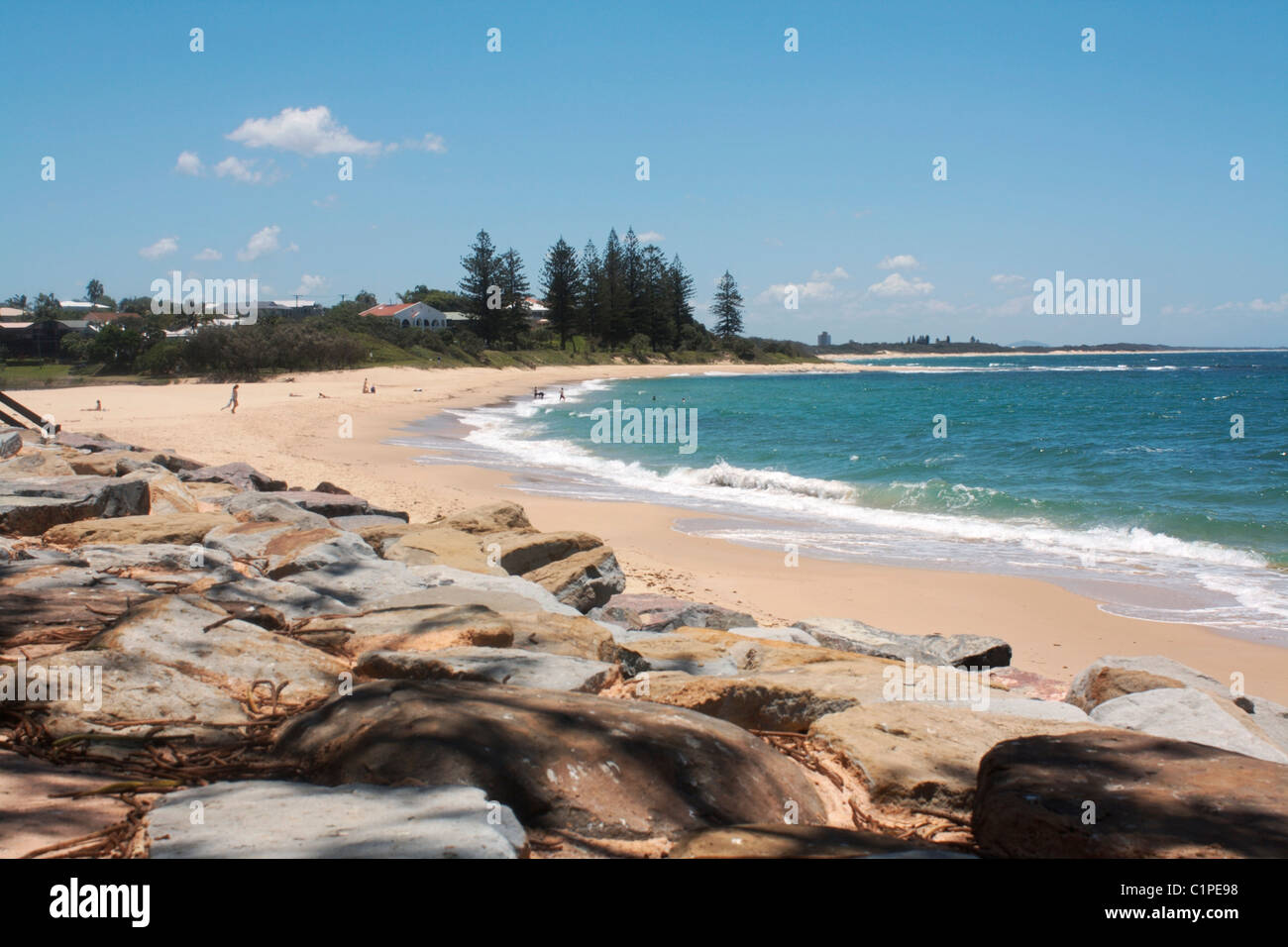 Australia, Queensland, Moffat Beach, rocks and people on beach Stock ...