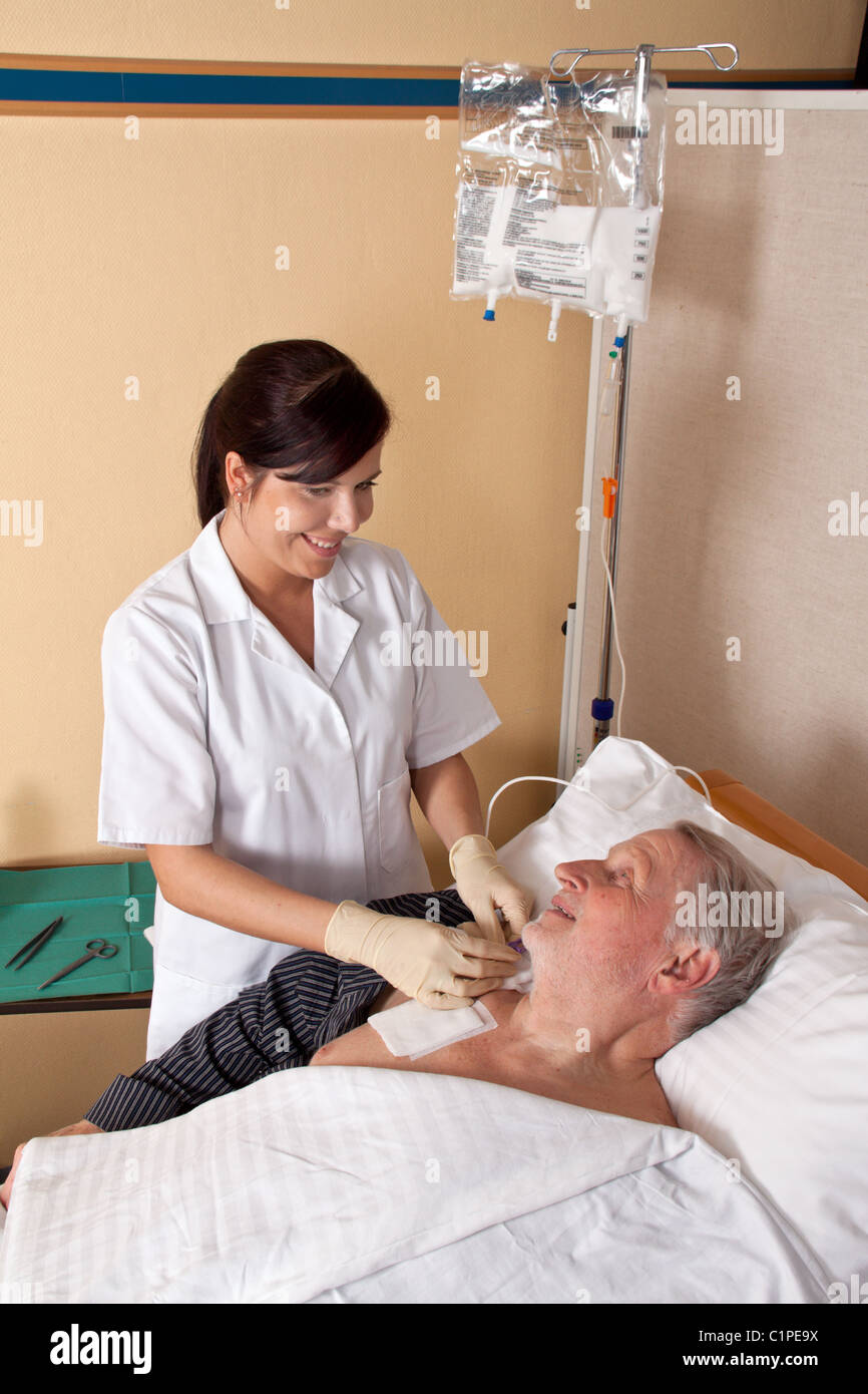 Nurse gives a patient an infusion Stock Photo - Alamy