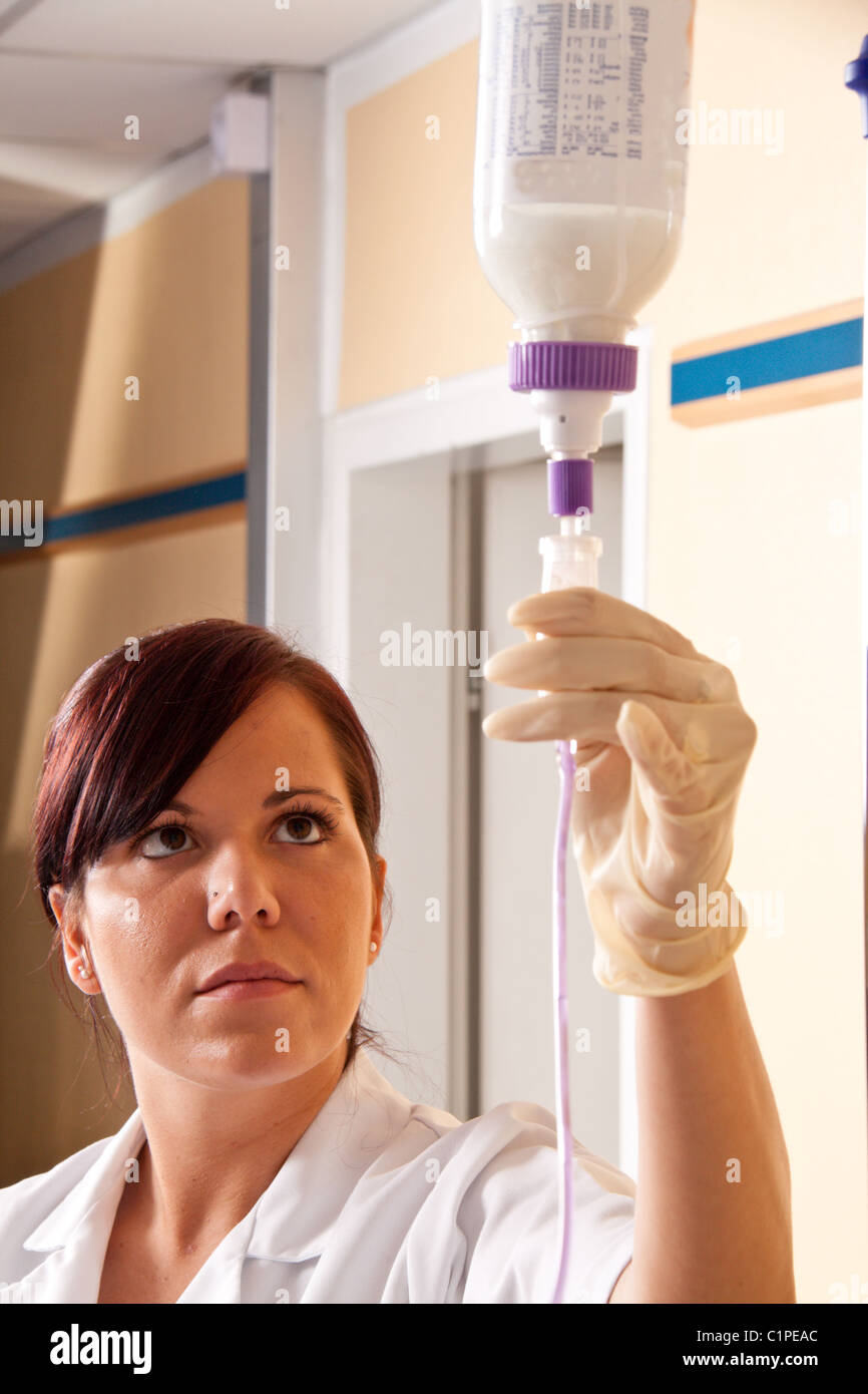 Nurse gives a patient an infusion Stock Photo - Alamy