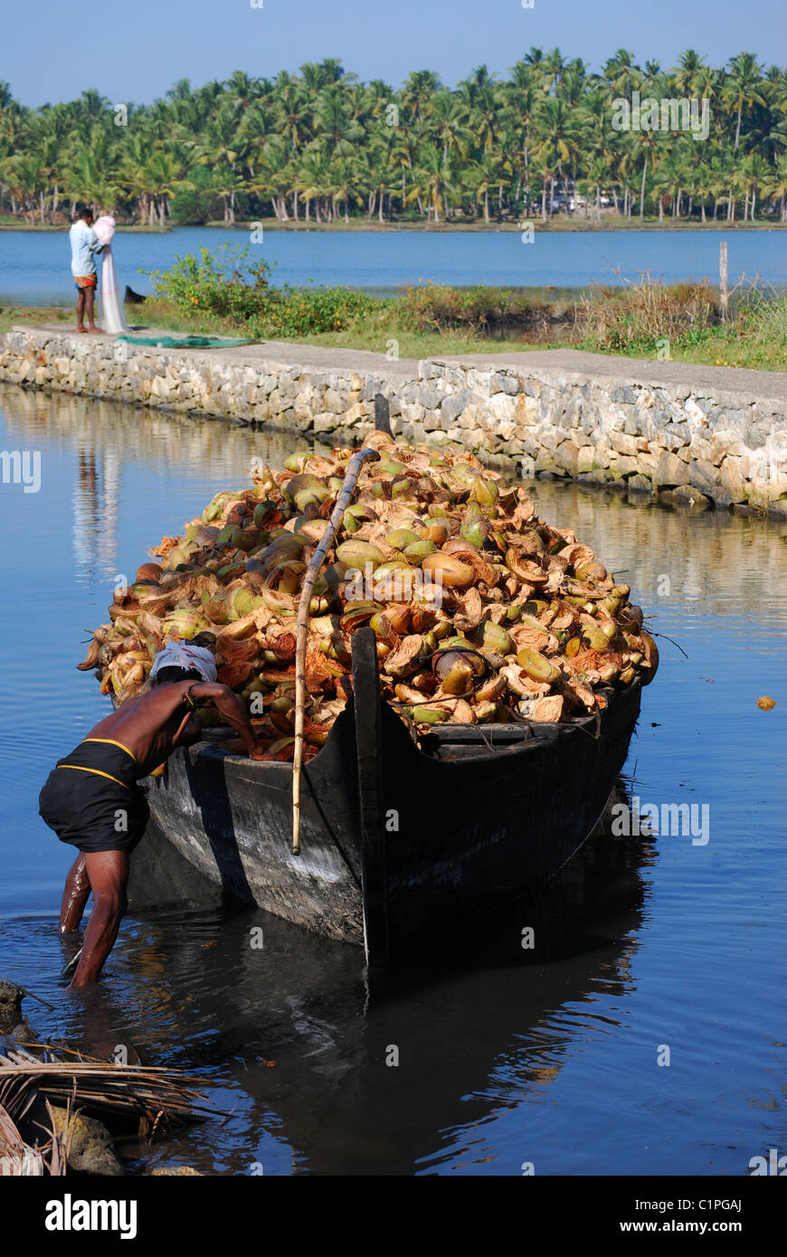 transporting coconut husk for coir making , kerala backwaters, kerala ...
