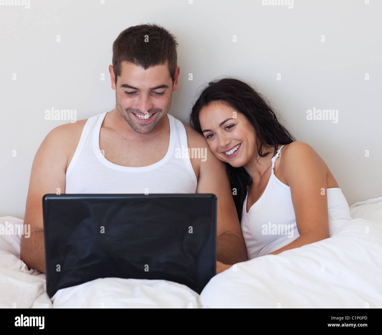 Husband and wife lying in bed Stock Photo - Alamy