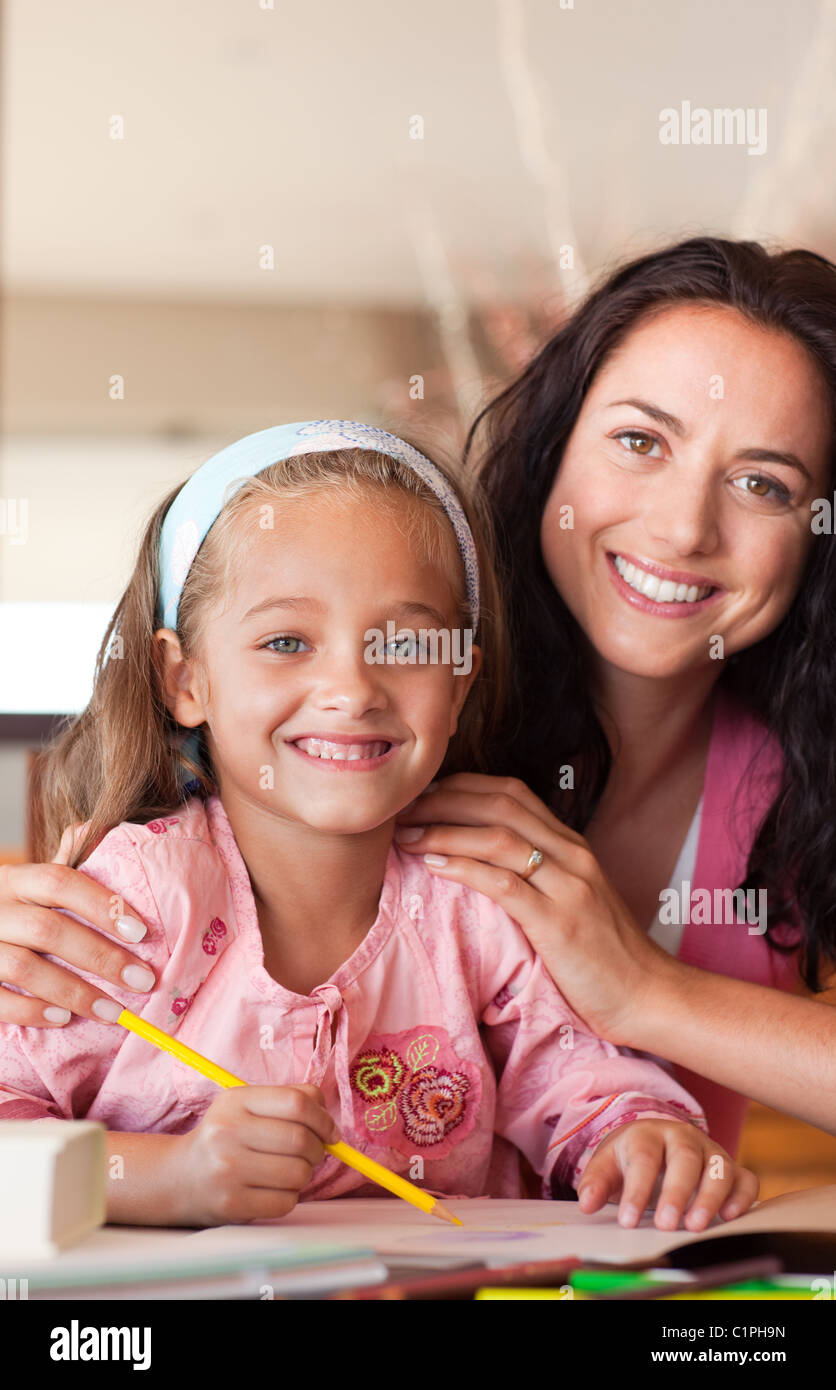 Portrait of a protective mother with smiling daughter Stock Photo - Alamy
