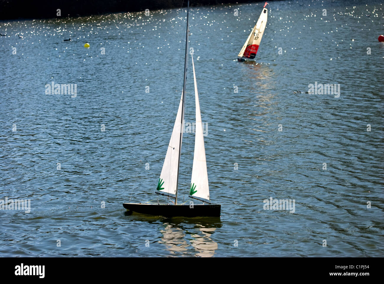 Model yachts on a boating lake Stock Photo - Alamy