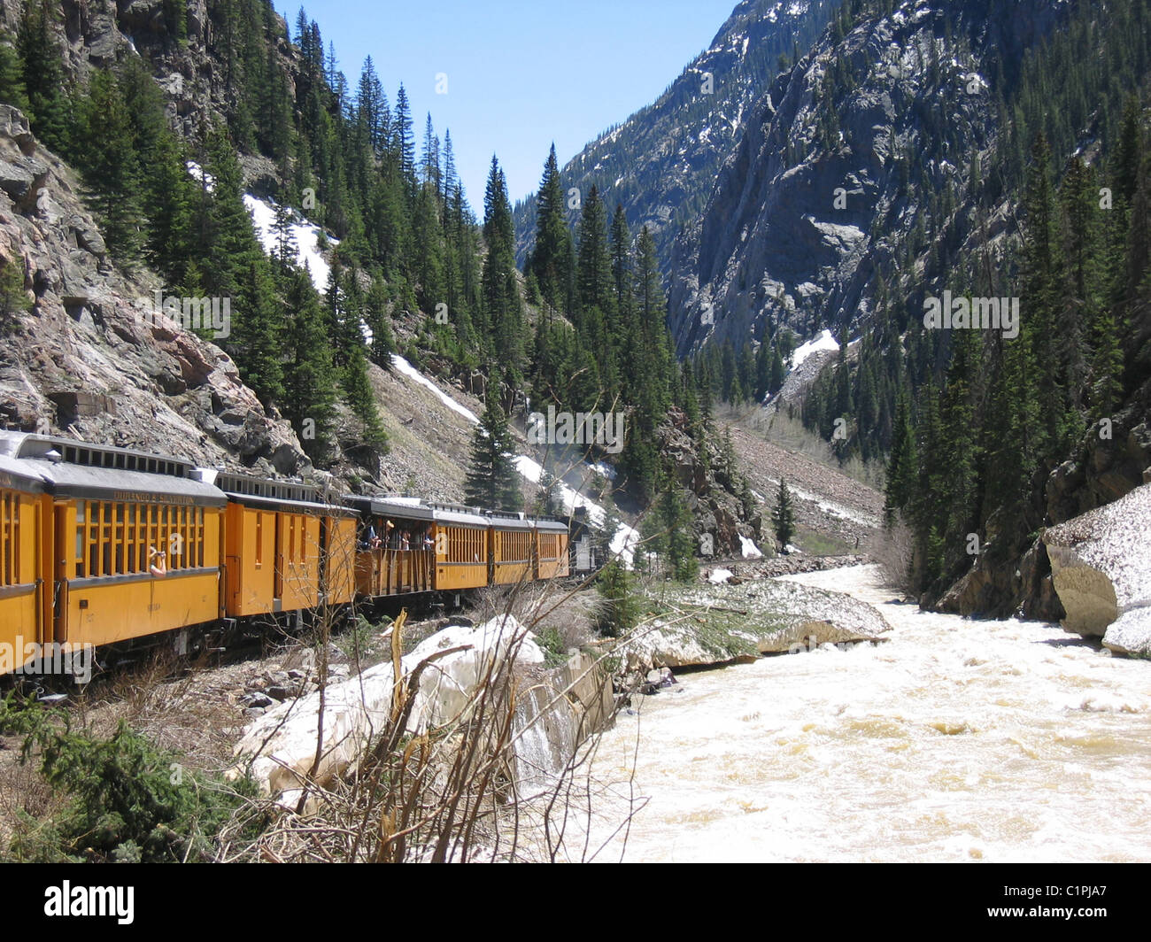 Colorado mountains are on view, as a train moves along the Durango ...