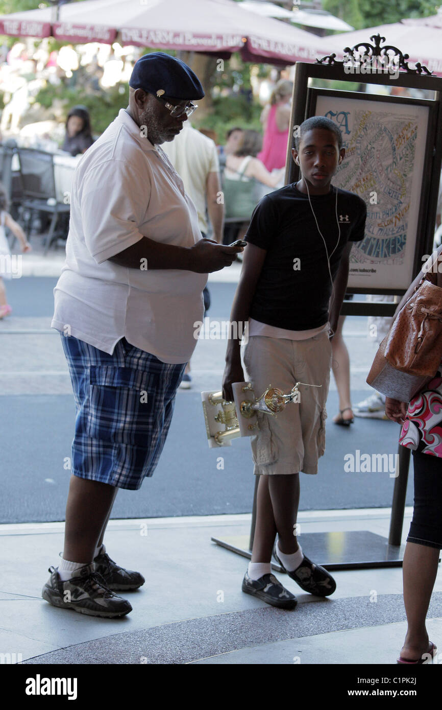Quincy Jones III (son of Quincy Jones) and his son, who is carrying a ...