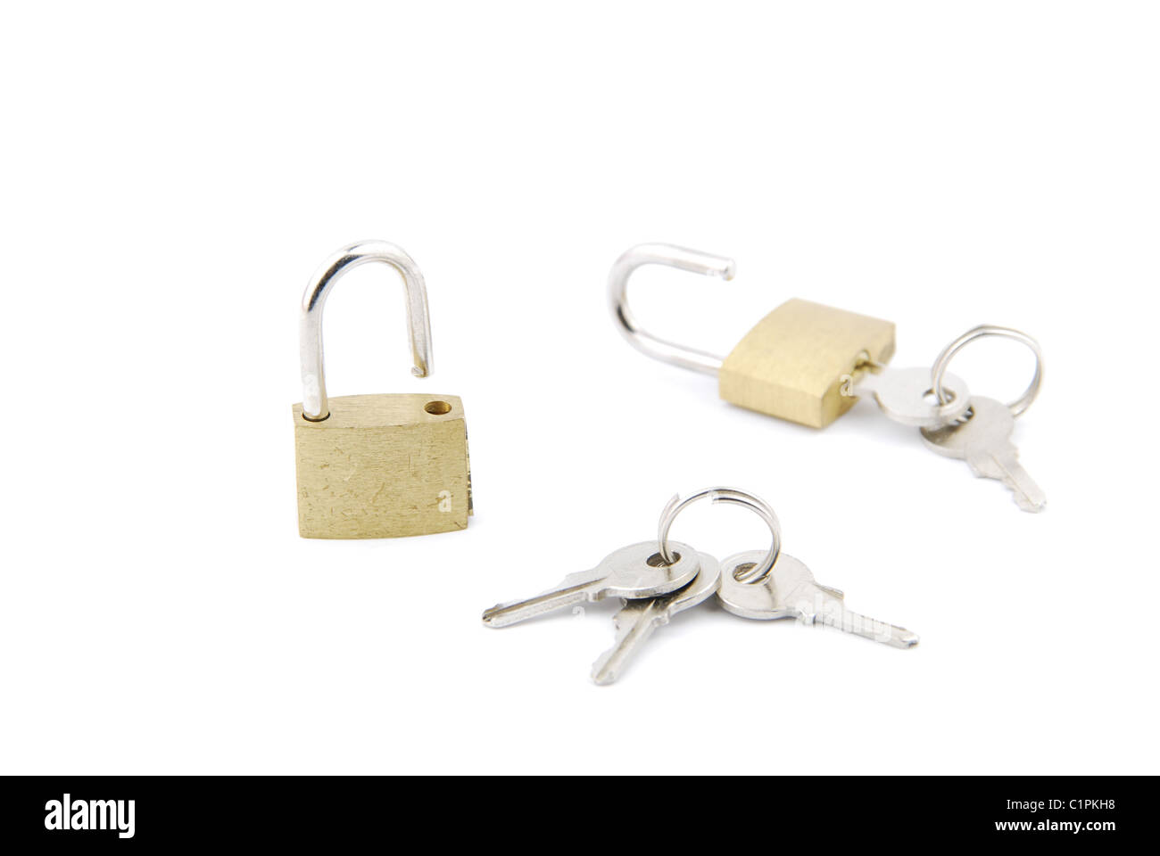 Golden open padlock with keys on white Stock Photo - Alamy