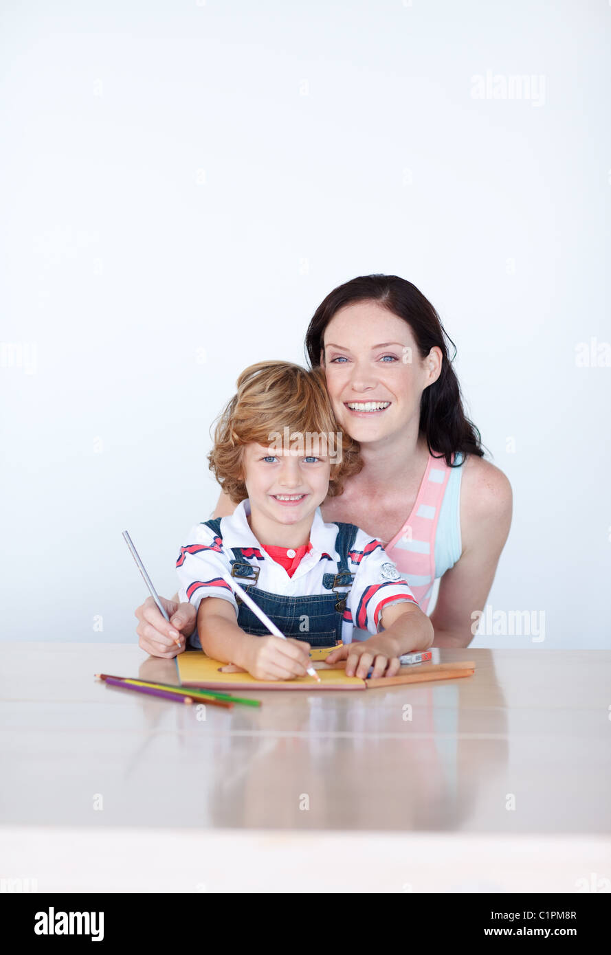 Bright mother and son smiling to the camera Stock Photo - Alamy