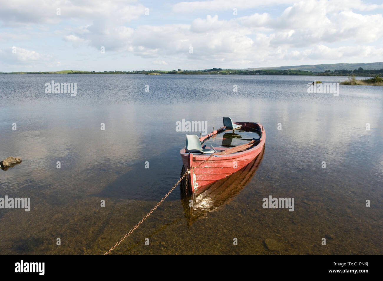 Republic of Ireland, Connemara, Lough Corrib, boat moored on lake Stock ...