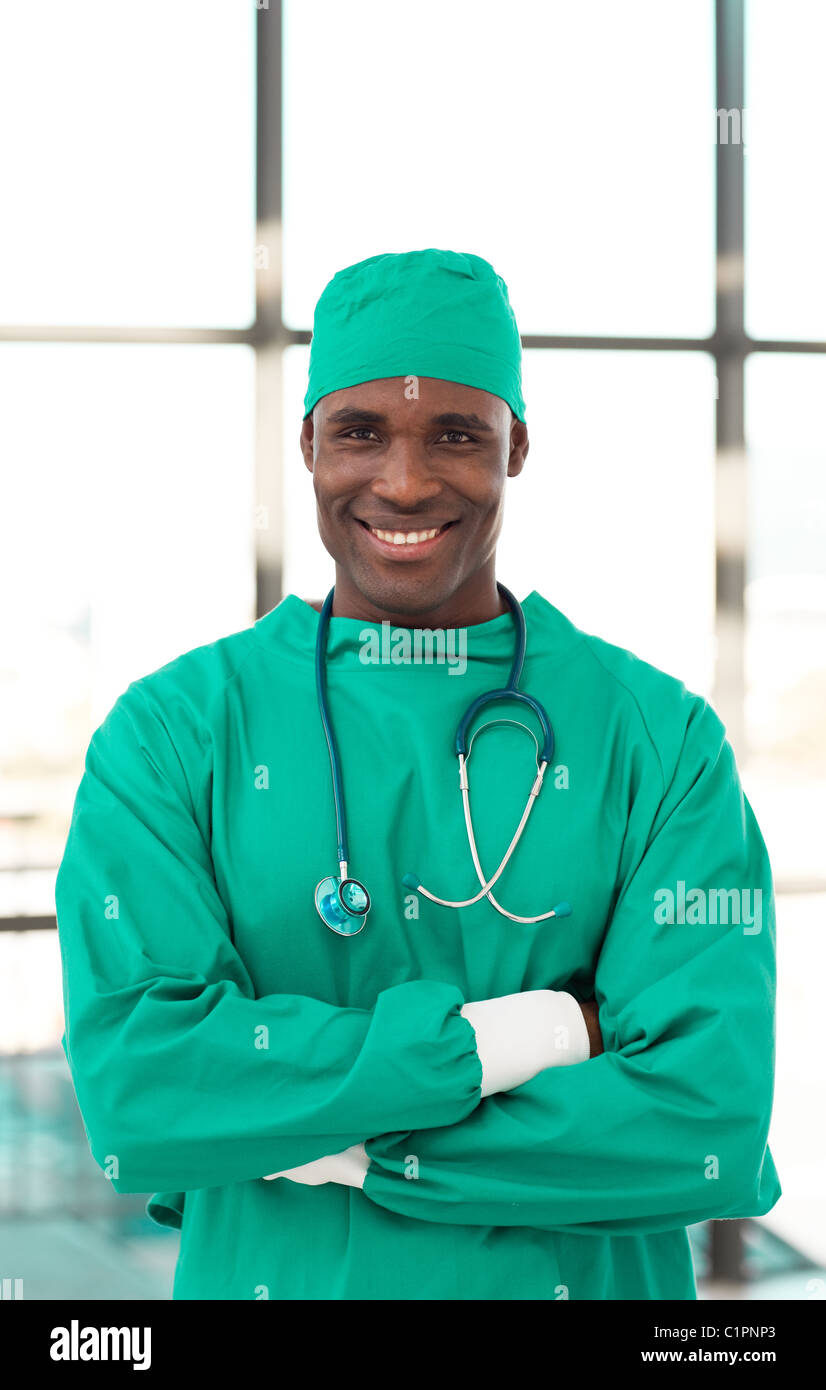 Positive surgeon in green scrubs Stock Photo - Alamy