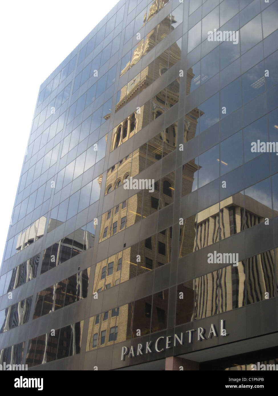 Reflections of an opposite building in glass window of modern office ...